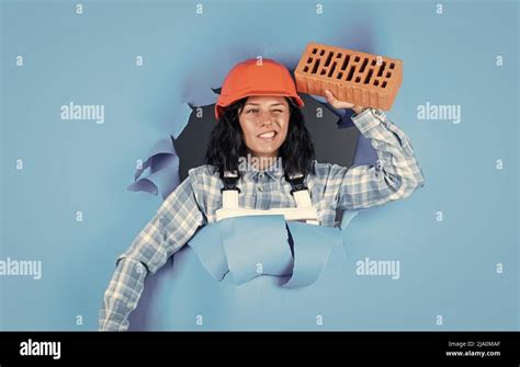 Builder Assistant Wear Protective Helmet Girl In Workshop Uniform