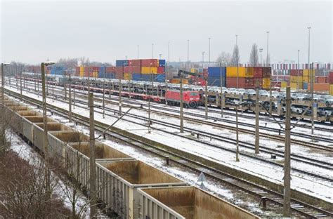 On The Platform There Are Wagons With Cars Empty Wagons Unloaded Containers Nearby On The