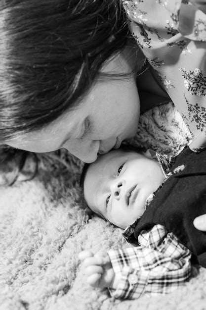 Premium Photo Mother And Son Lying On Bed