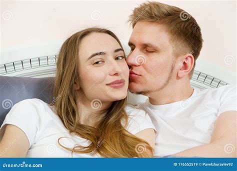 Beautiful Awakened Loving Couple In Bed In The Morning Young Adult