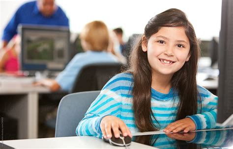 Computer Class Cheerful Computer Student At Desk By Stocksy Contributor Sean Locke Stocksy