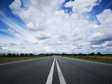 Vanishing Point A Straight Road In Wyoming Disappearing In The