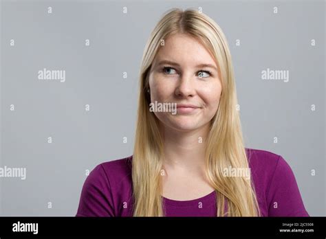young woman is thinking and shows emotional expressions Stock Photo - Alamy