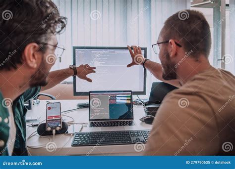 Programmers Engrossed In Deep Collaboration Diligently Working