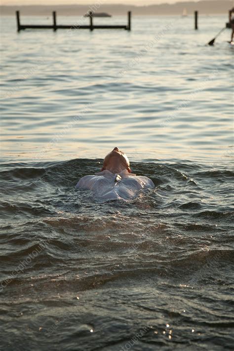 Man Floating In Water Stock Image F Science Photo Library