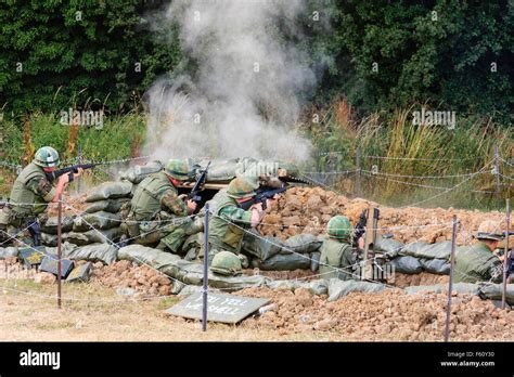 Vietnam War Rolling Thunder Re Enactment Group Marines Crouching Down In Trench Shooting