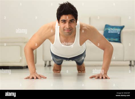 Man Doing Push Ups In Home Stock Photo Alamy