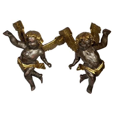 Pair Of 18th Century Italian Puttini In Giltwood For Sale At 1stdibs
