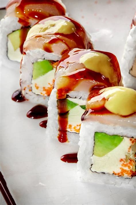 Closeup Of Sushi Rolls With Scallop Cream Cheese Tobiko Avocado An