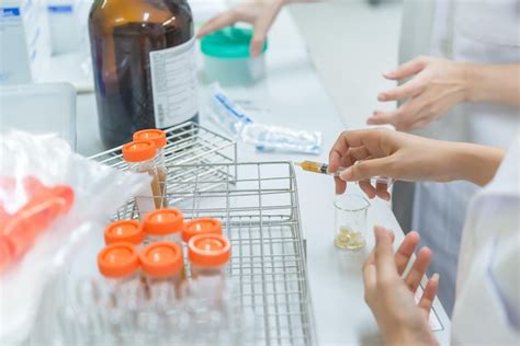Premium Photo Two Scientist Mix Chemicals Make Experiment In The Labmixture Laced With Samples