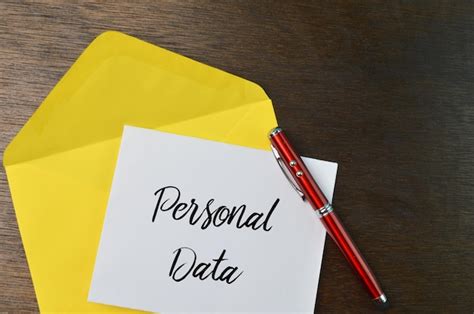 Premium Photo Yellow Envelope Pen And White Paper With Text Personal Data
