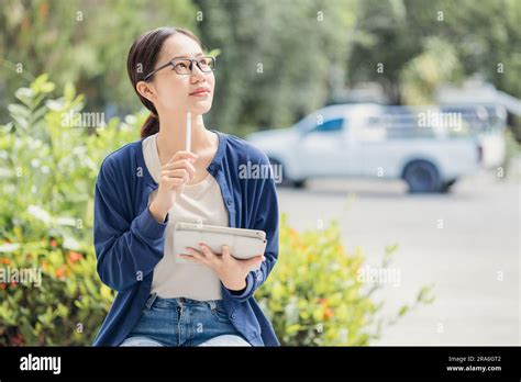 University Asian Teen Girl Using Tablet Thinking Solve Problem Learning