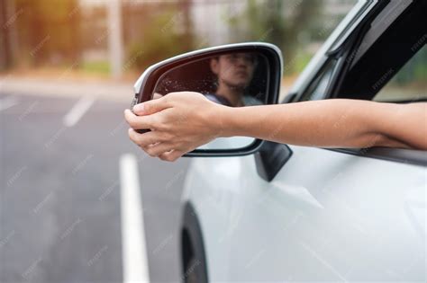 Woman Driver Adjusting Side View Mirror A Car Journey Trip And Safety