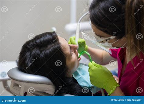 Dentist Cleaning Teeth Of Woman Stock Image Image Of Cleaning