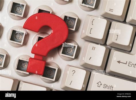 Close Up Of A Disassembled Computer Keyboard With A Red Question Mark