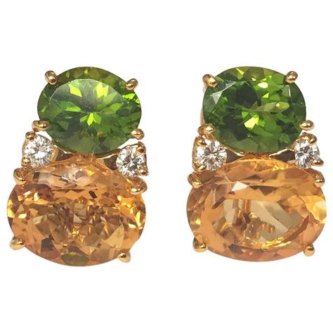 cassandra goad riviere double peridot and diamond earrings for sale at
