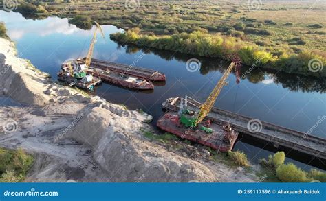 River Floating Cranes Unload Barges With Bulk Materials On The River Bank Stock Footage Video