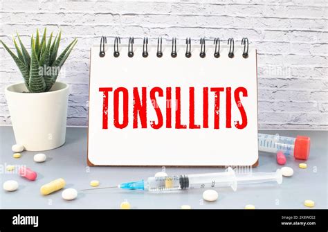 Doctor Keeps A Card With The Name Of The Diagnosis Tonsillitis