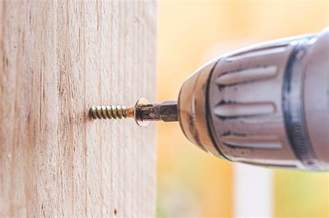 Premium Photo Do It Yourself Close Up Of Screw And Screwing Machine Workshop