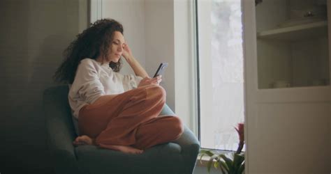 Woman Scrolling Through Phone Stock Footage SBV 346538722 Storyblocks