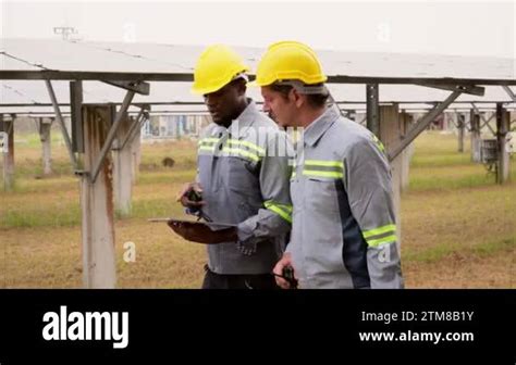 Teamwork Engineers Team Checking Security Protection System At Solar