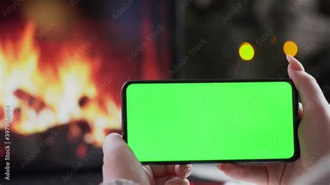 Close up shot of female , holding a smartphone with chroma key mock up green screen - technology ...