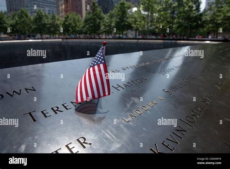 Miniature Stars And Stripes Flags Mark The Names Of The Remembered At