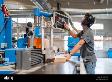Carpenter Operating Control Panel In Production Hall Stock Photo Alamy