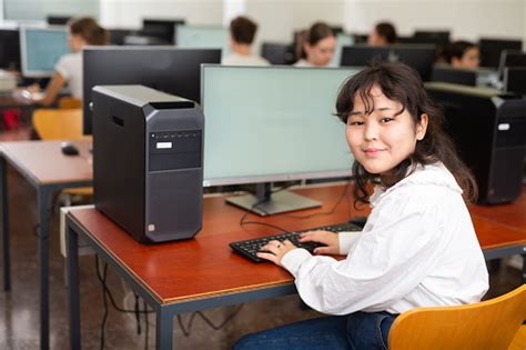 Smart Asian Female Teenager Learning Computer Science While She Is