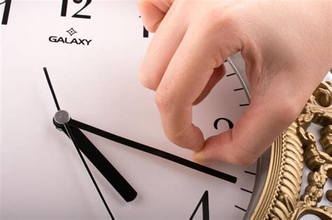 Premium Photo Hand In Touch With A Clock