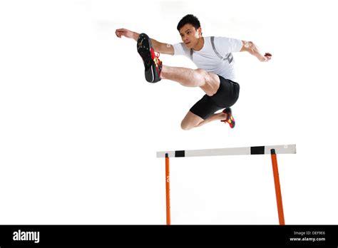 Man Jumping Hurdle Stock Photo Alamy
