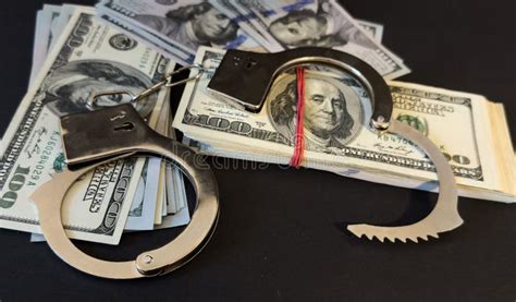 Banknotes Dollars Money And Handcuffs Isolated On Black Background