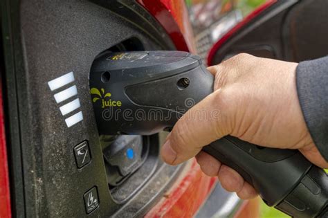 Hand Of A Man Plugging In The Charger Of An Electric Car Editorial Image Image Of Motor