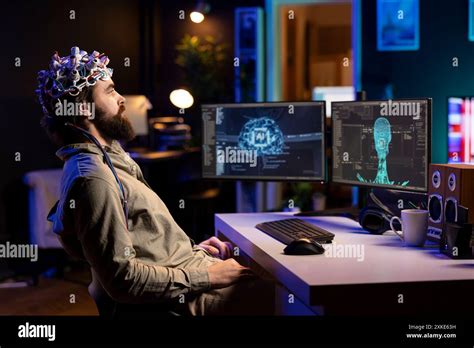 Computer Engineer Wearing Eeg Headset On Head To Communicate With