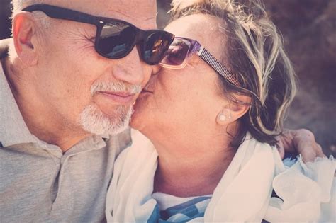 Premium Photo Mature Woman Kissing Man