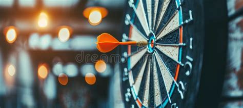 extreme precision close up of dart hitting the bullseye on dartboard
