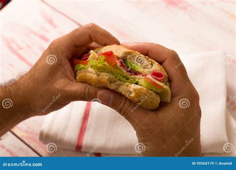 Close Up A Man Holding A Sandwich Stock Image Image Of Grain