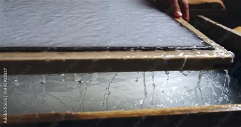 Super Slow Motion Macro Of Lifting The Mould And Deckle After Paper