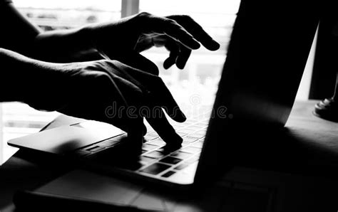 Hands Of Anonymous Hackers Typing Code On Keyboard Of Laptop For Stock Photo Image Of Business