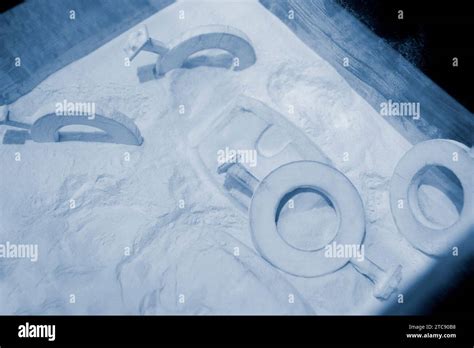 Objects Printed On A 3d Printer From Powdered Polyamide Lying In White Polyamide Powder Models