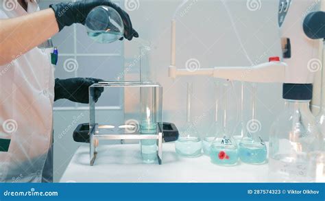 Researcher Conducting Chemical Experiments Of Soil In Laboratory Close
