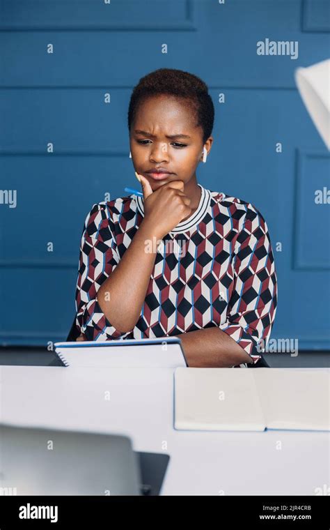 african businesswoman analyzing information while working with