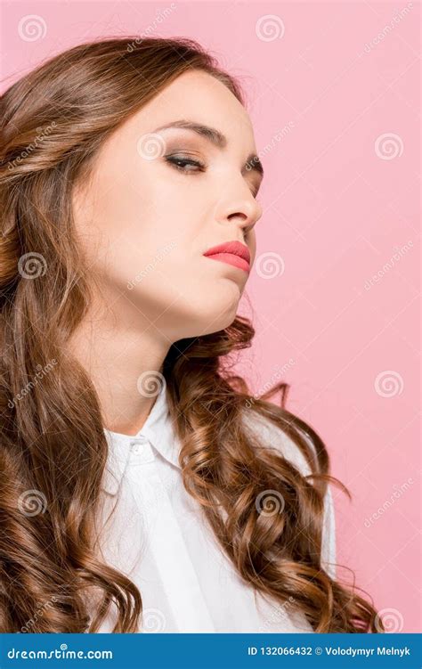 Portrait Of Young Woman Arrogantly Looking In Camera Isolated Stock