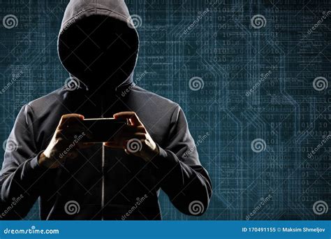 Dangerous Hacker With A Smartphone Gadget Over Digital Background With