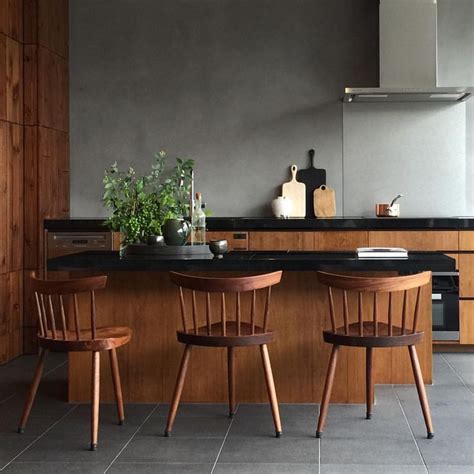Modern Japanese Kitchen Design With Wooden Cabinets And Black Countertops