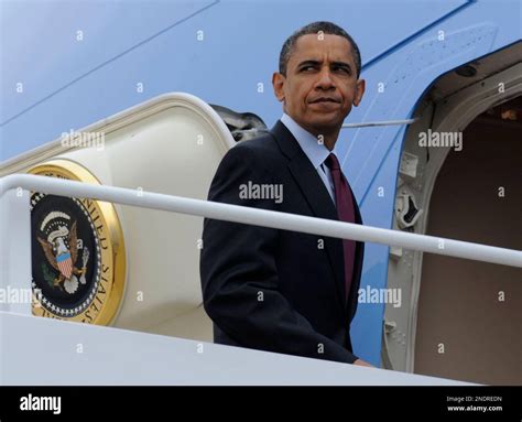 President Barack Obama Looks Back After Walking Up The Steps Of Air