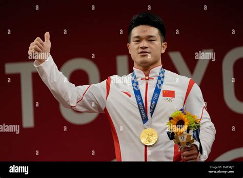 Shi Zhiyong Of China Celebrates On The Podium After Winning The Gold
