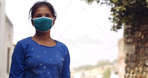 Closeup Shot Of An Indian Girl Wearing A Mask New Normal Concept Stock