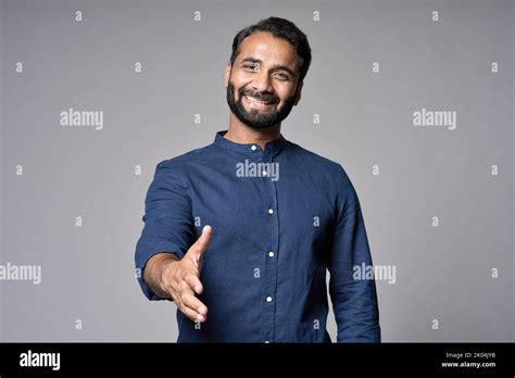 Smiling Indian Business Man Extending Hand For Handshake Isolated On