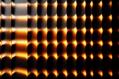 Premium Photo A Close Up Of A Metal Screen With The Light Reflecting Off It